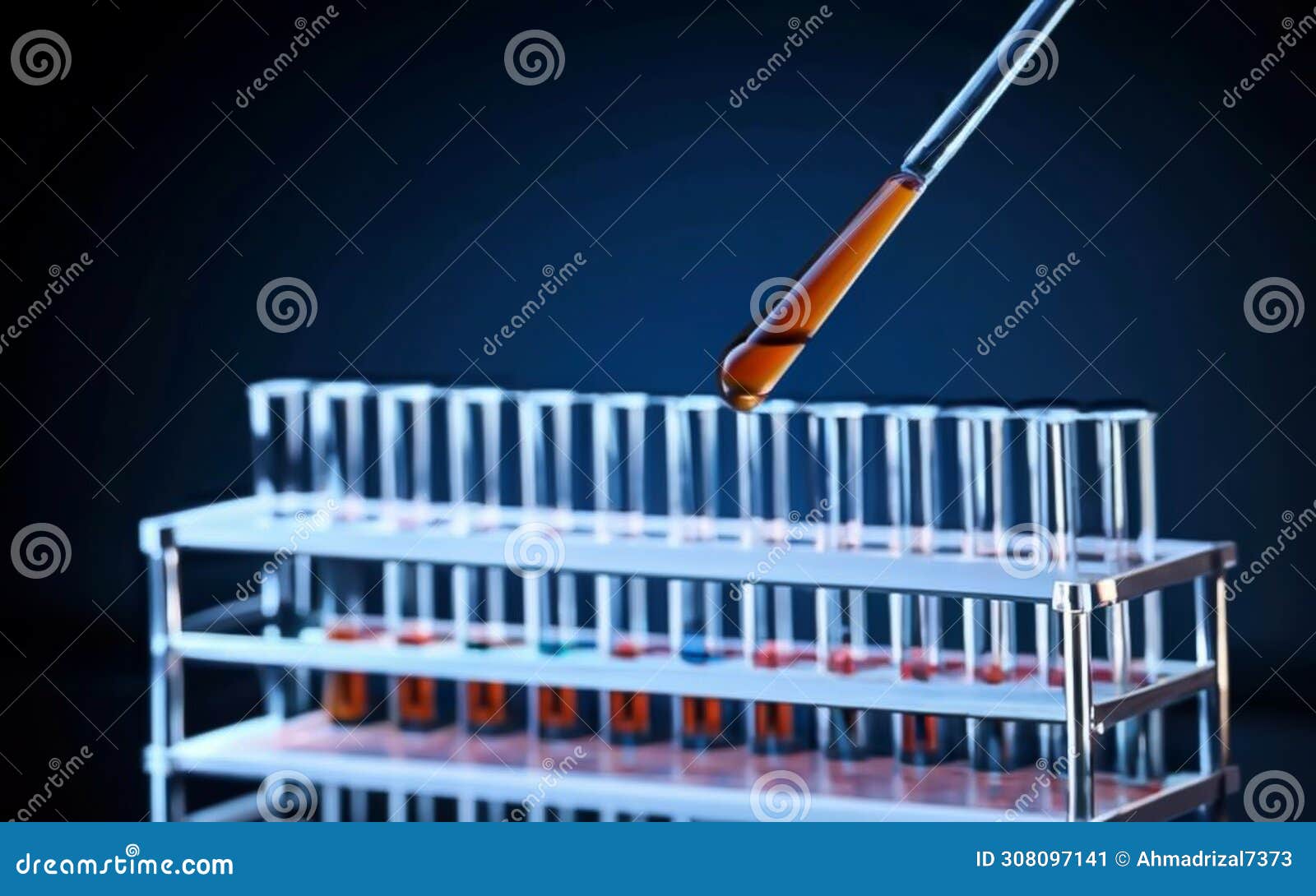 Laboratory Pipette with Drop of Blue Liquid Over Test Tubes Filled ...