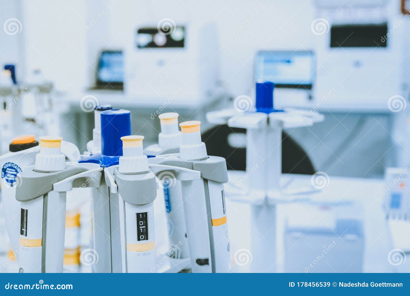 Laboratory Pipettes on Blurred Laboratory Background. Research and ...