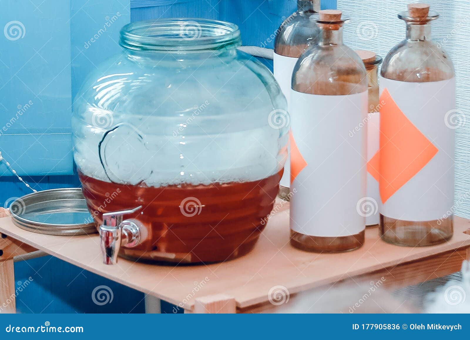 A Large Jar with Red Liquid and Three Bottles. School Stock Photo ...