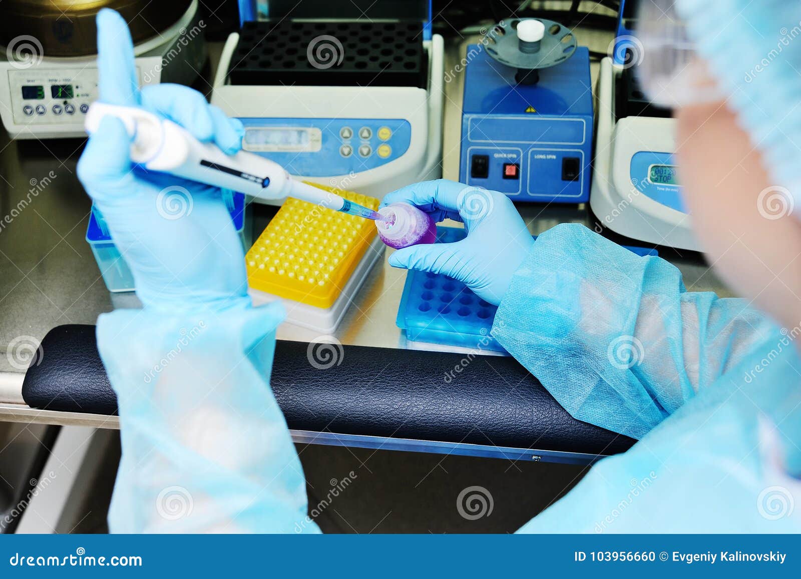 A Laboratory Scientist with a Dispenser in His Hands Conducts ...