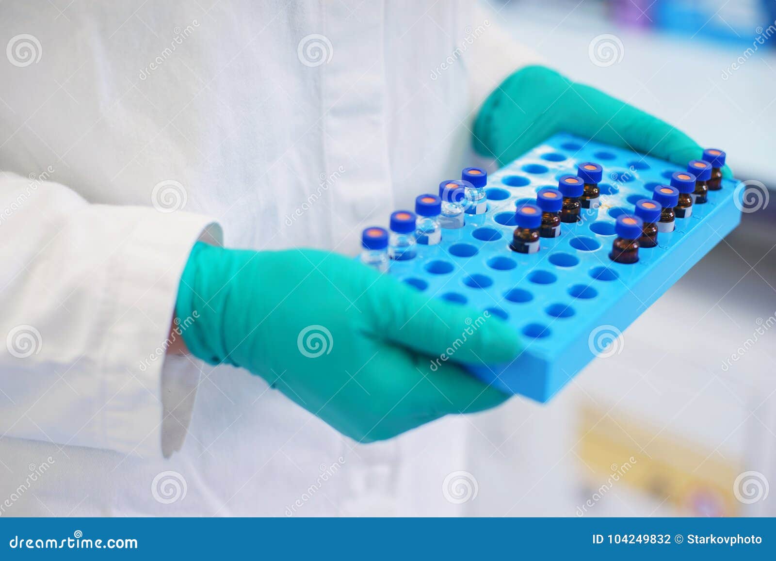 Laboratory Scientist Holds a Plastic Box with Samples of Transparent ...