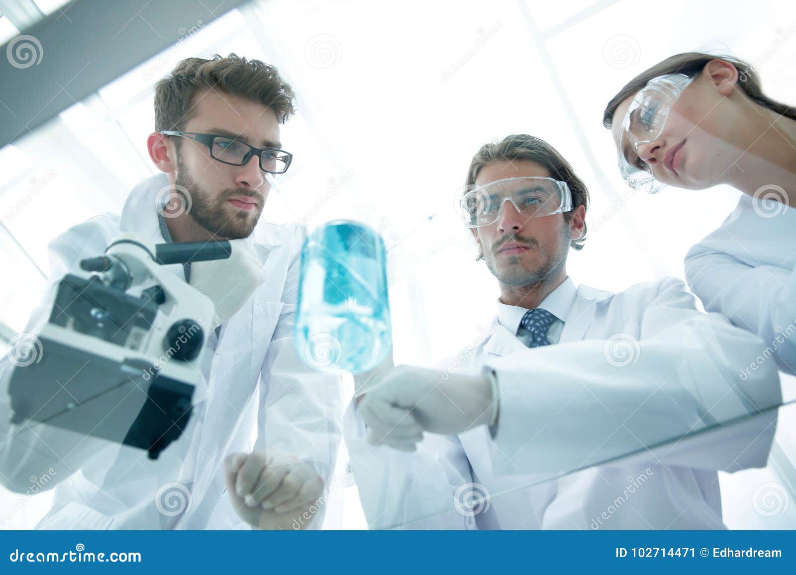 Group of Scientists Working on an Experiment at the Laboratory Stock ...