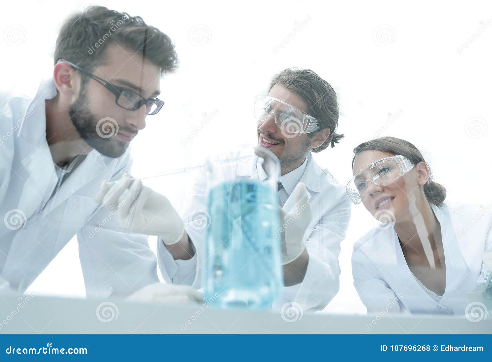 Group of Scientists Working on an Experiment at the Laboratory Stock ...