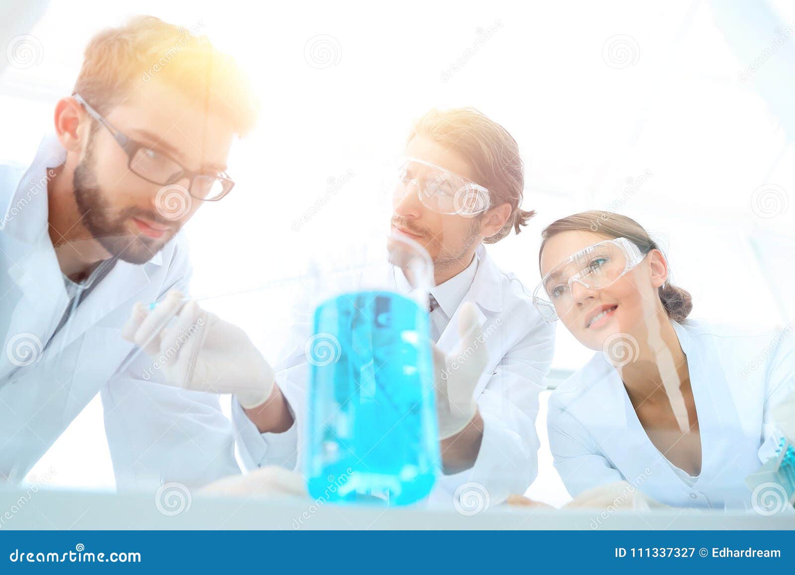 Group of Scientists Working on an Experiment at the Laboratory Stock ...