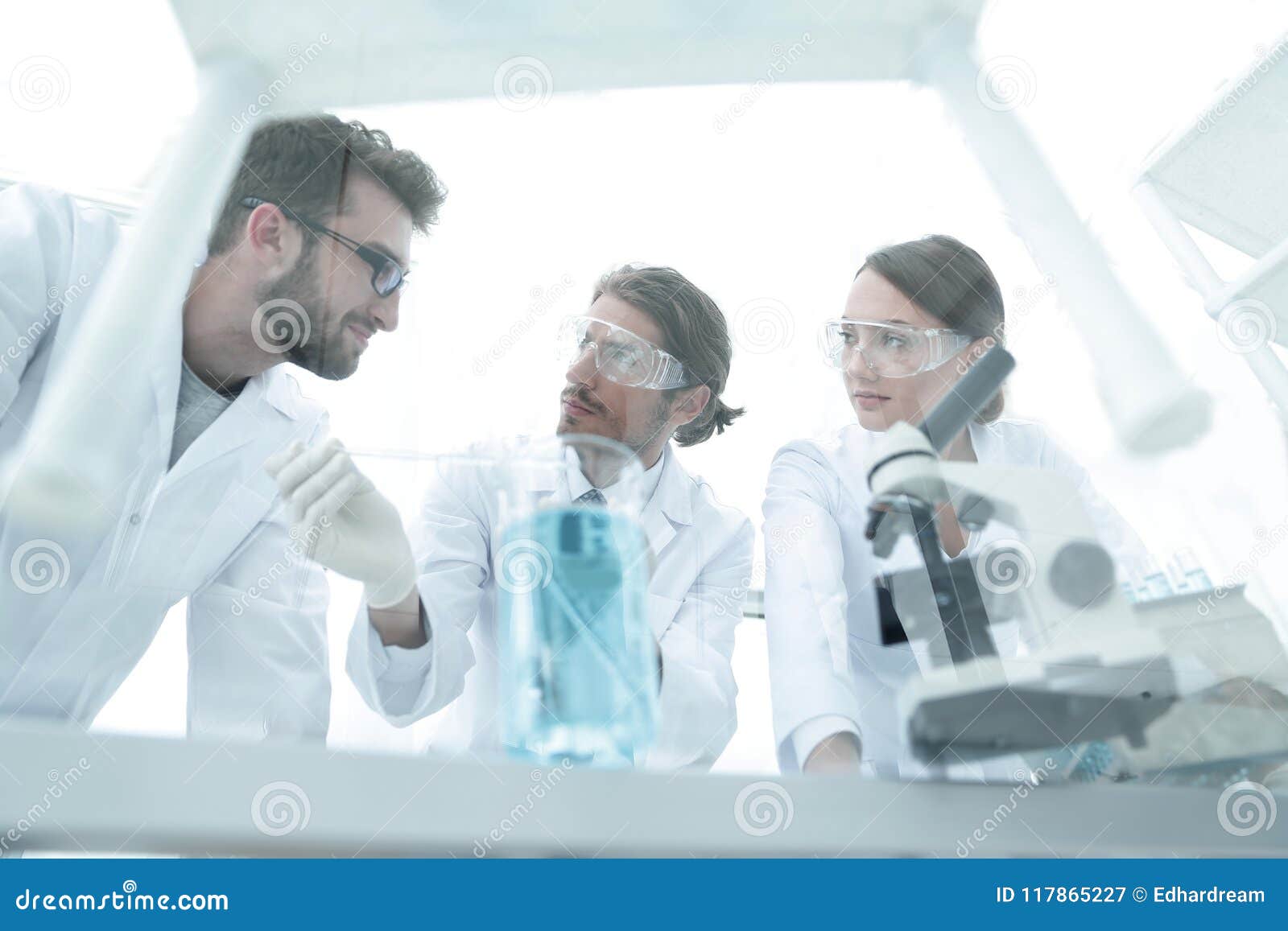 Group of Scientists Working on an Experiment at the Laboratory Stock ... Group of Scientists Working on an Experiment at the Laboratory Stock ...