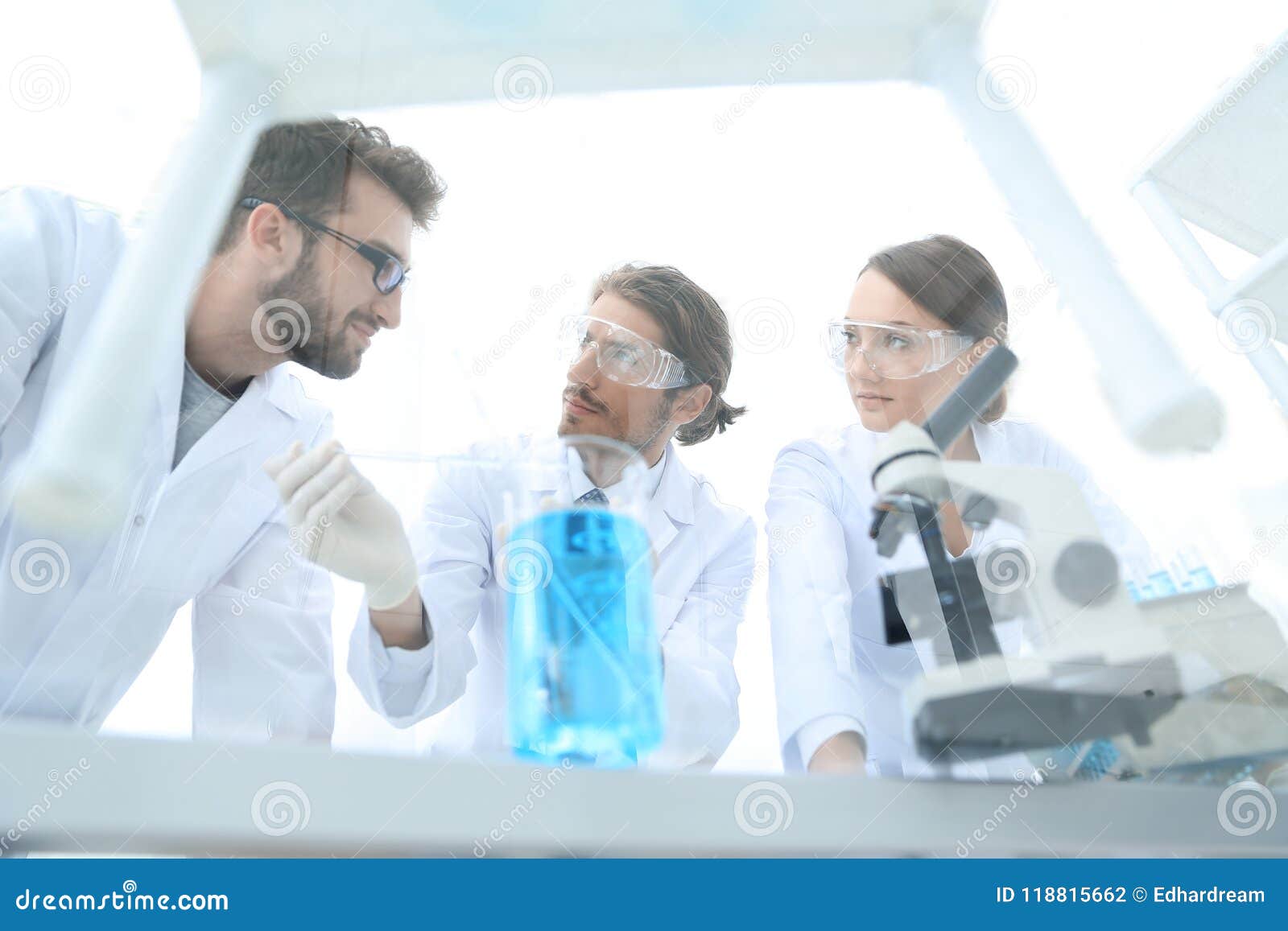 Group of Scientists Working on an Experiment at the Laboratory Stock ...