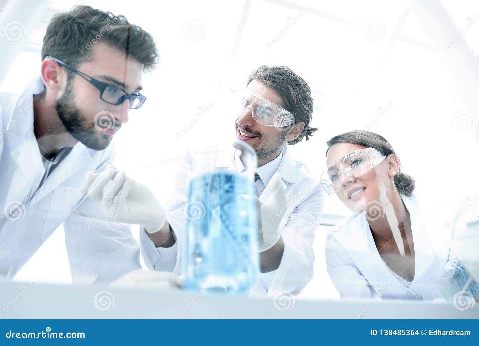 Group of Scientists Working on an Experiment at the Laboratory Stock ...