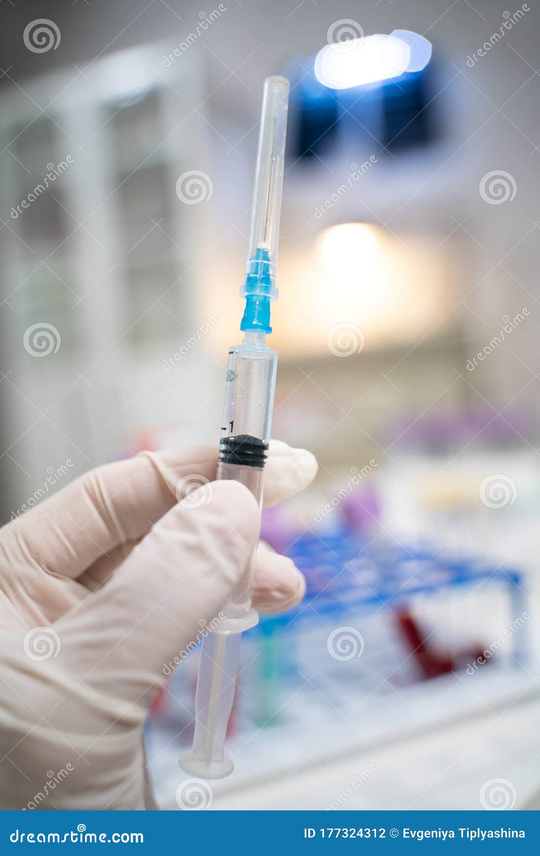 Syringe in hand stock photo. Image of chemical, health - 177324312