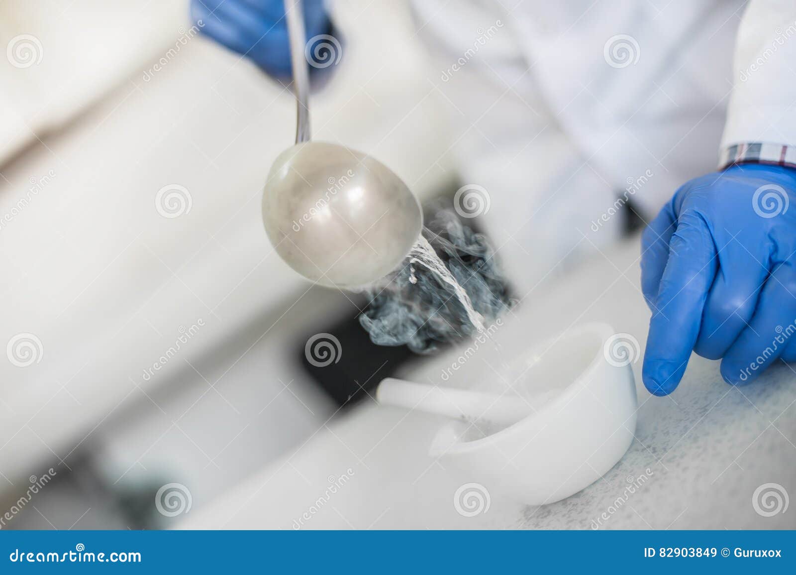 Laboratory Technician Performs an Experiment with Liquid Nitrogen Stock ...