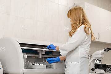 Laboratory Technician Test Blood in Automatic Blood Sample Analyzer ...