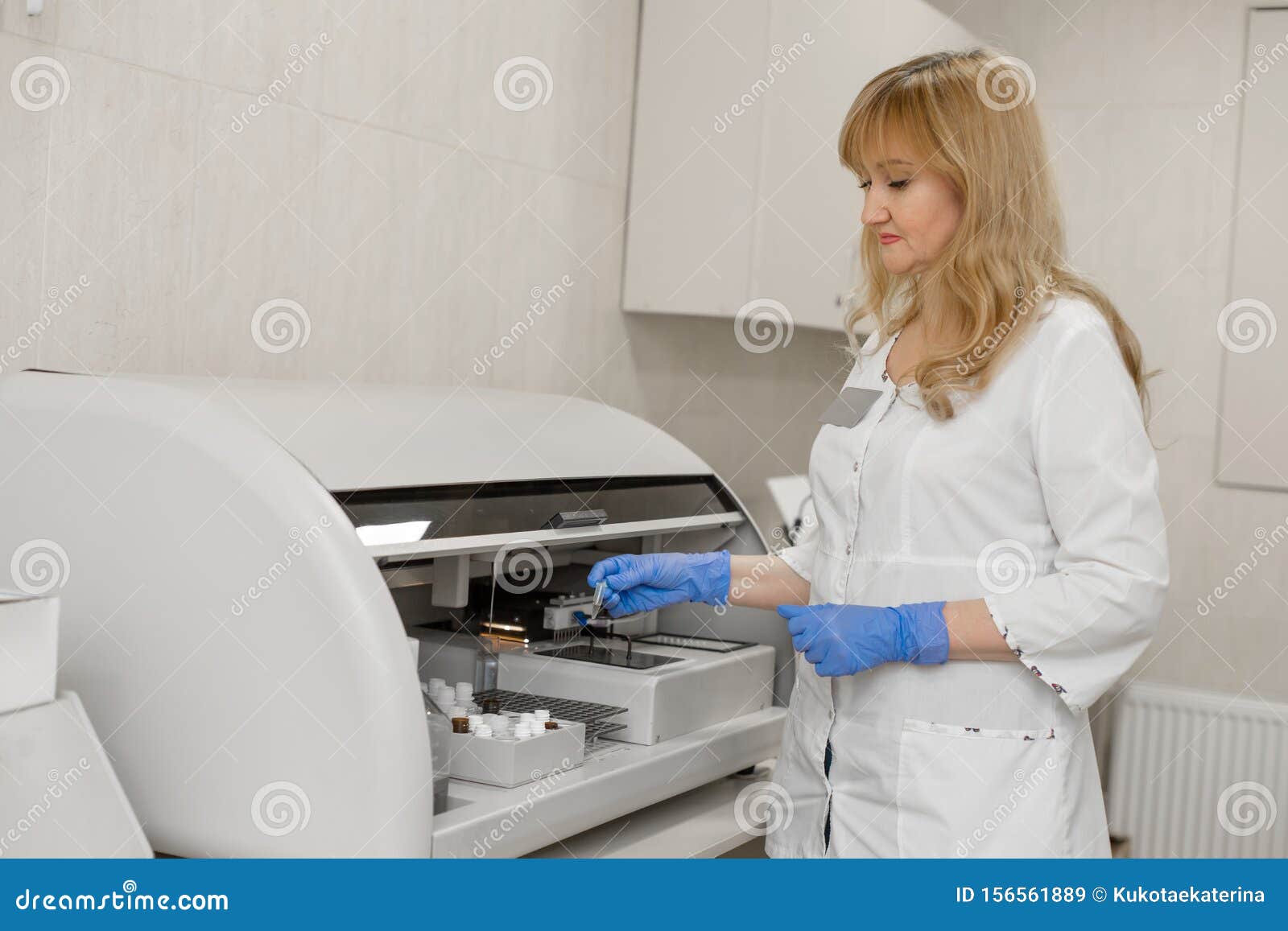 Laboratory Technician Test Blood in Automatic Blood Sample Analyzer ...