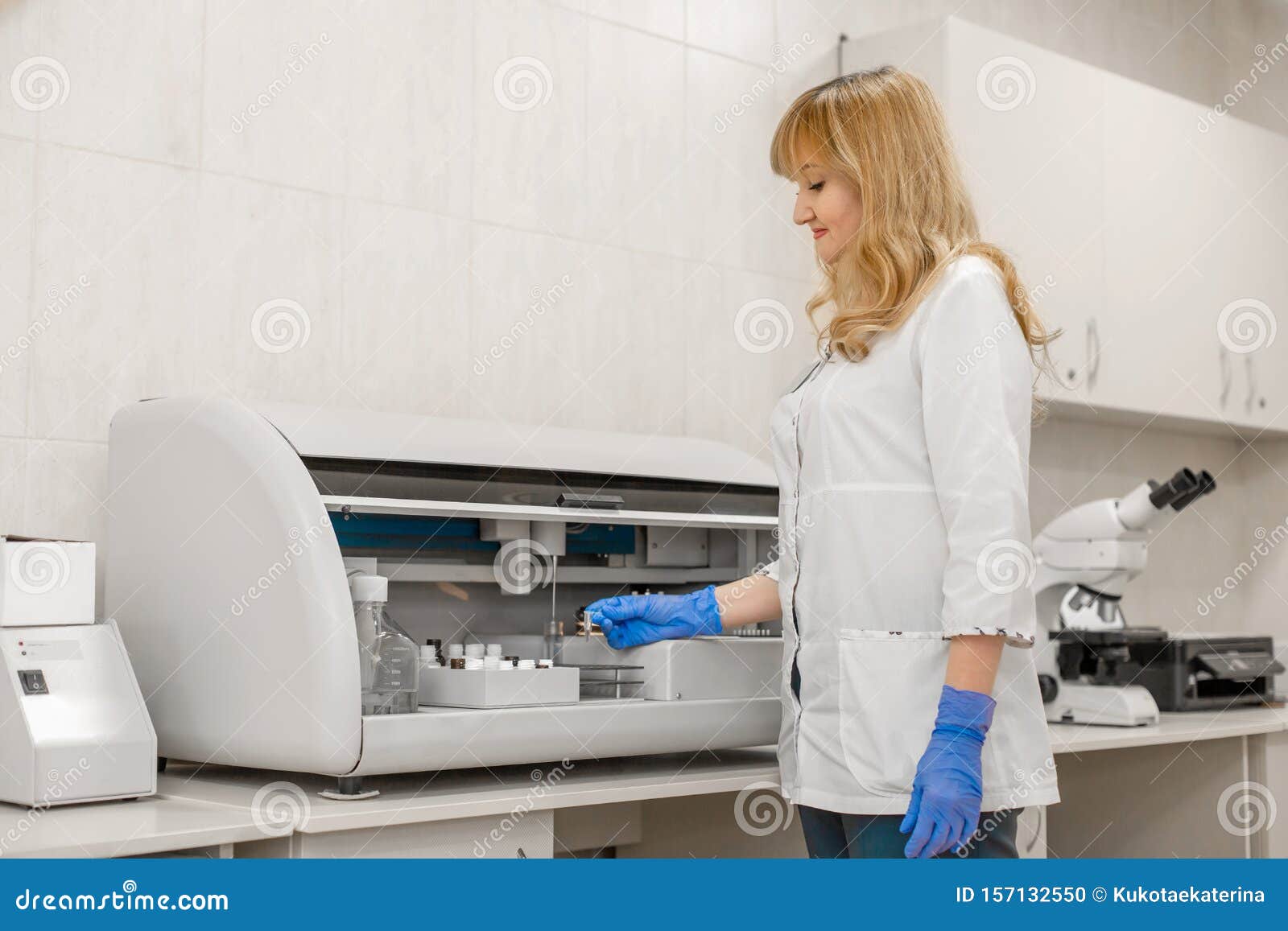 Laboratory Technician Test Blood in Automatic Blood Sample Analyzer ...