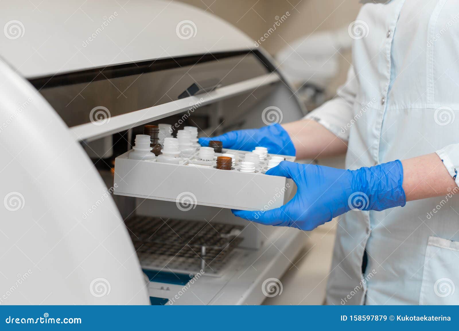Laboratory Technician Test Blood In Automatic Blood Sample Analyzer ...