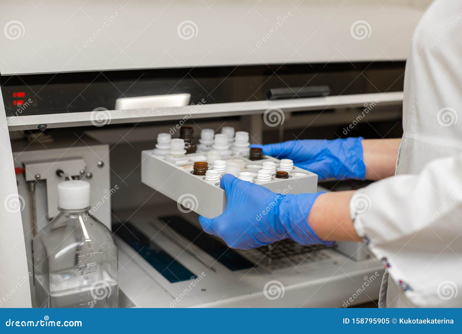 Laboratory Technician Test Blood in Automatic Blood Sample Analyzer ...