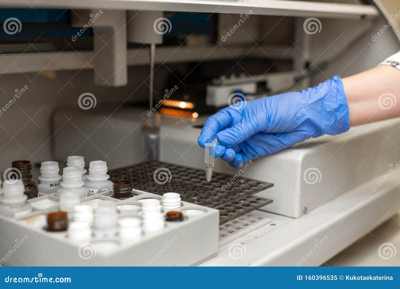 Laboratory Technician Test Blood In Automatic Blood Sample Analyzer ...