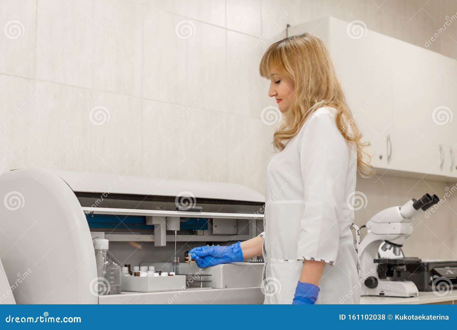 Laboratory Technician Test Blood in Automatic Blood Sample Analyzer ...