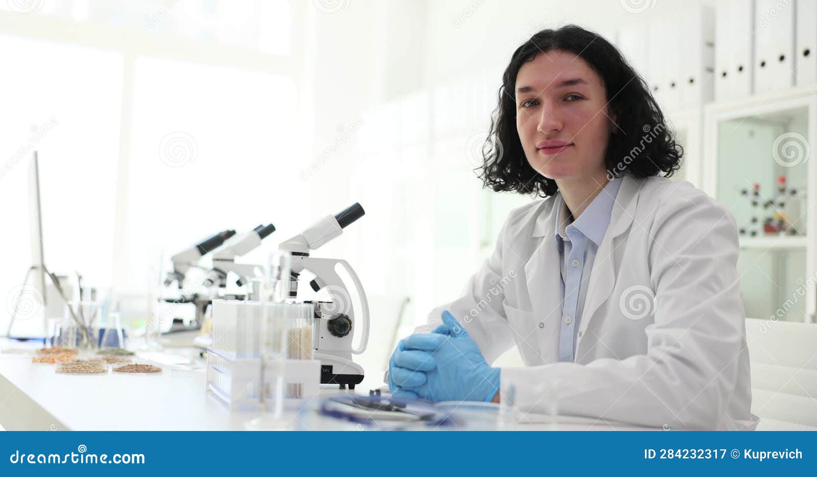 Laboratory Worker with Dark Hair at Table with Microscopes Stock Video ...