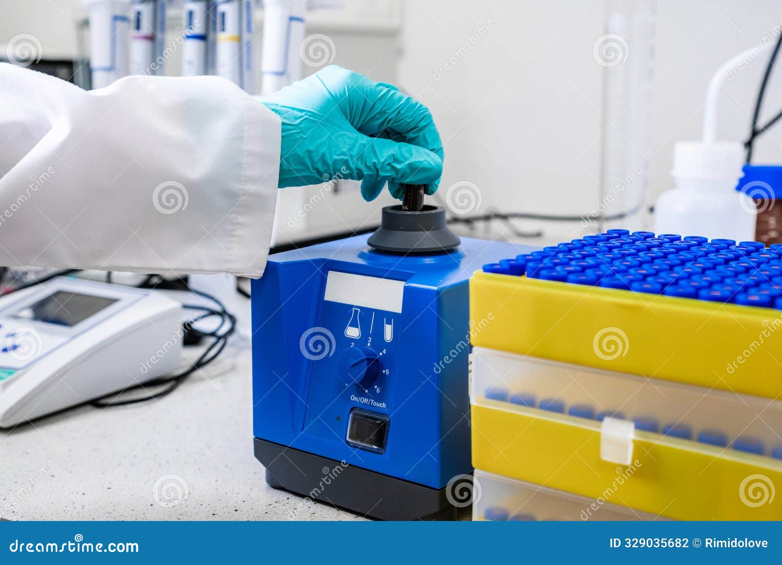 Laboratory Worker Mixes Samples with a Vortex Mixer in Preparation for ...