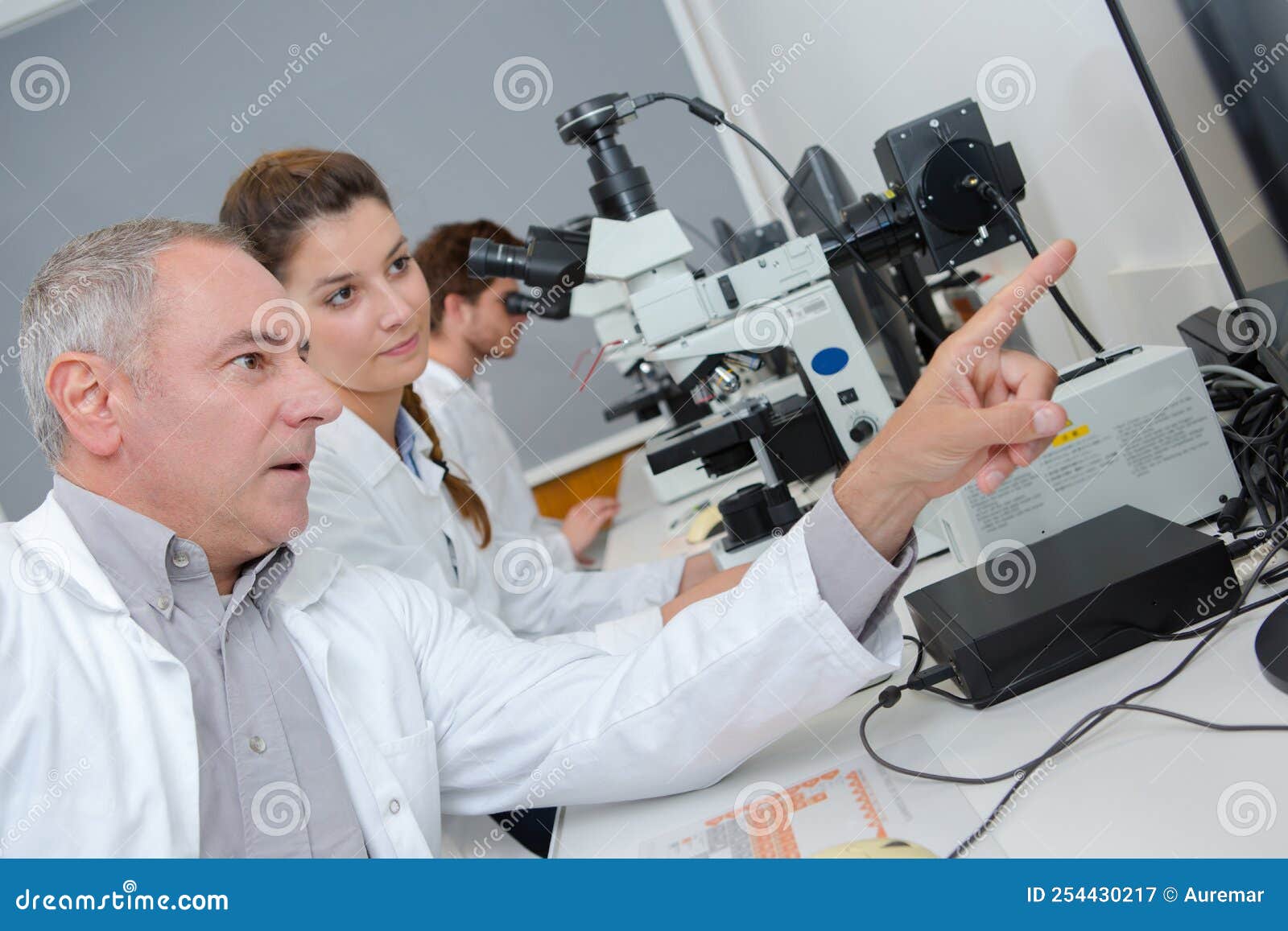Laboratory Worker Pointing To Screen Stock Image - Image of expertise ...