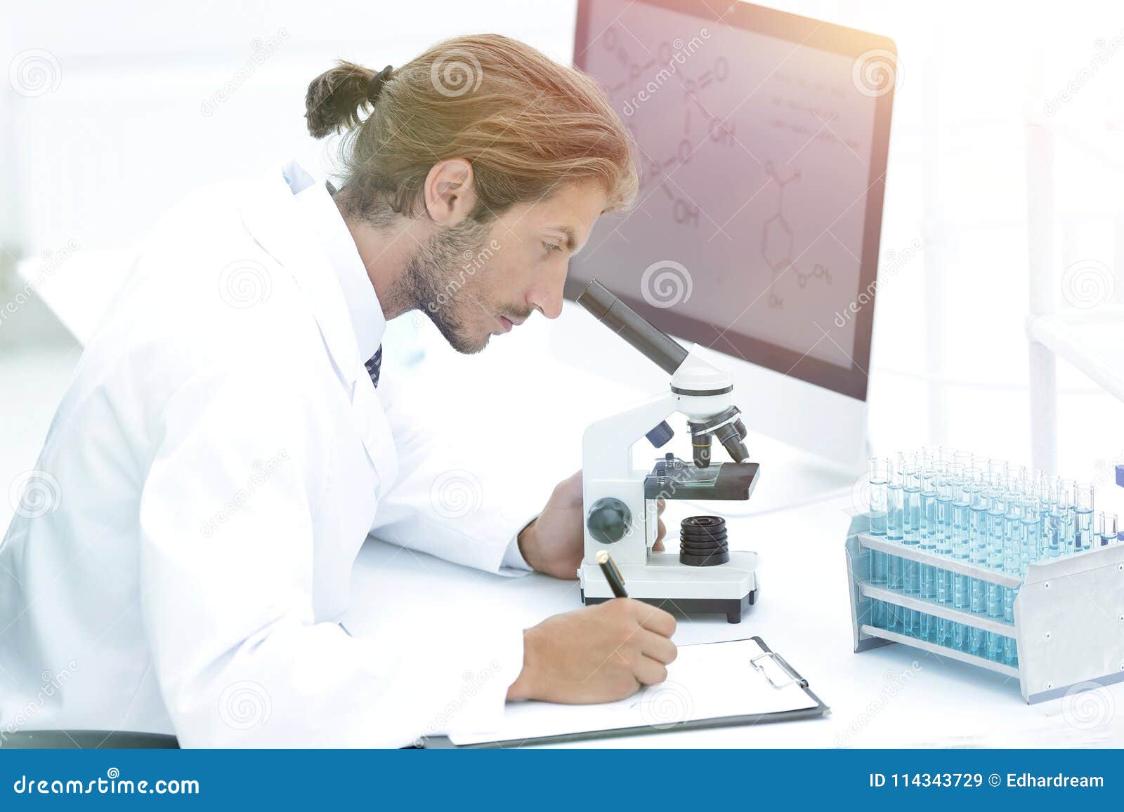 Laboratory Worker Sitting by Table with Microscope Stock Image - Image ...