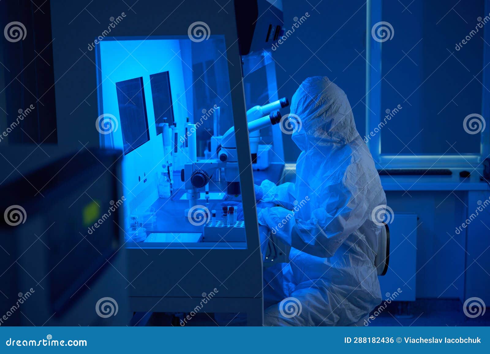 Laboratory Worker in a Sterile Uniform Uses Micromanipulator Set Stock ...