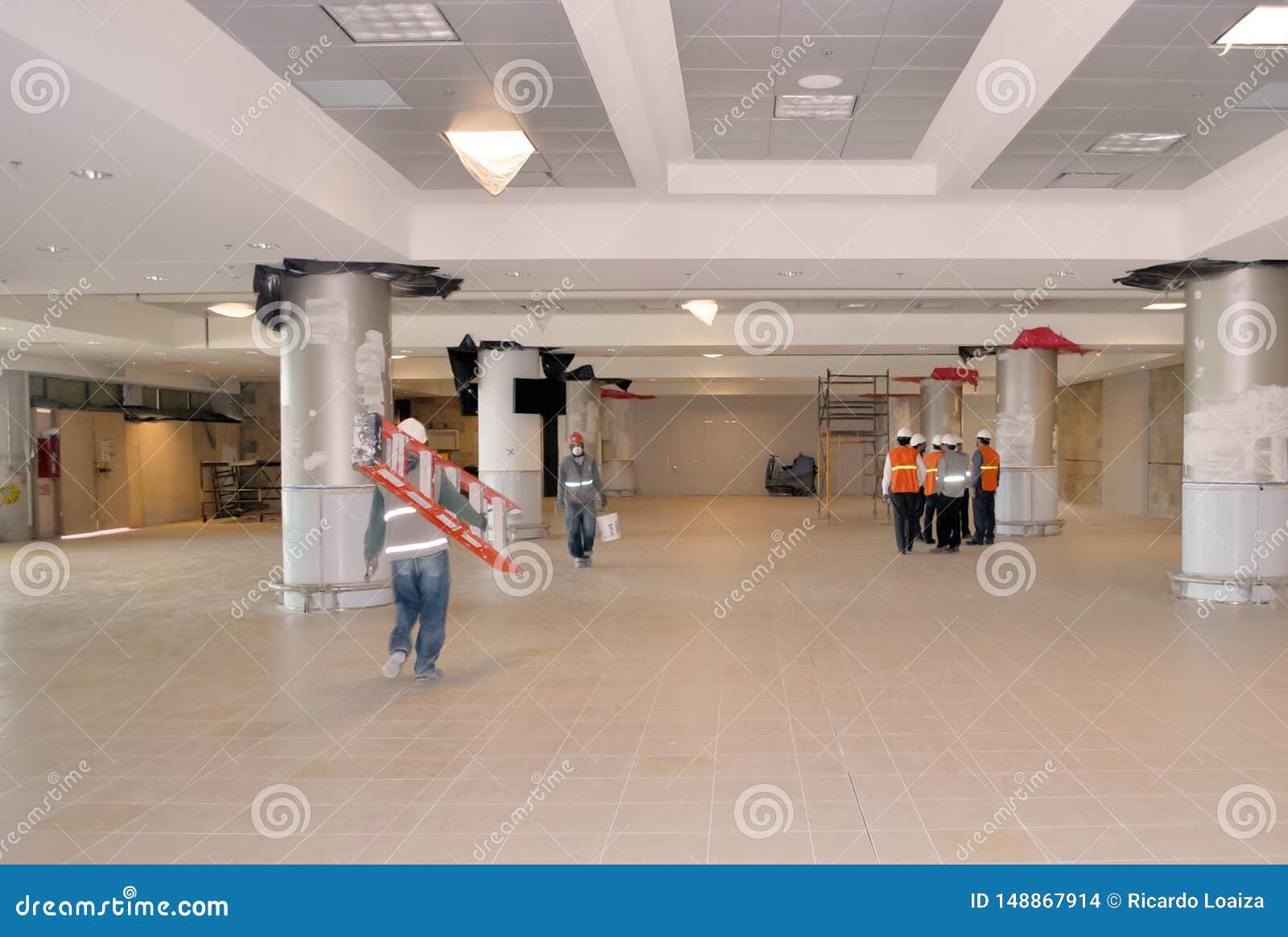 Workers Loading Construction Materials in Their Workspace. Stock Photo ...