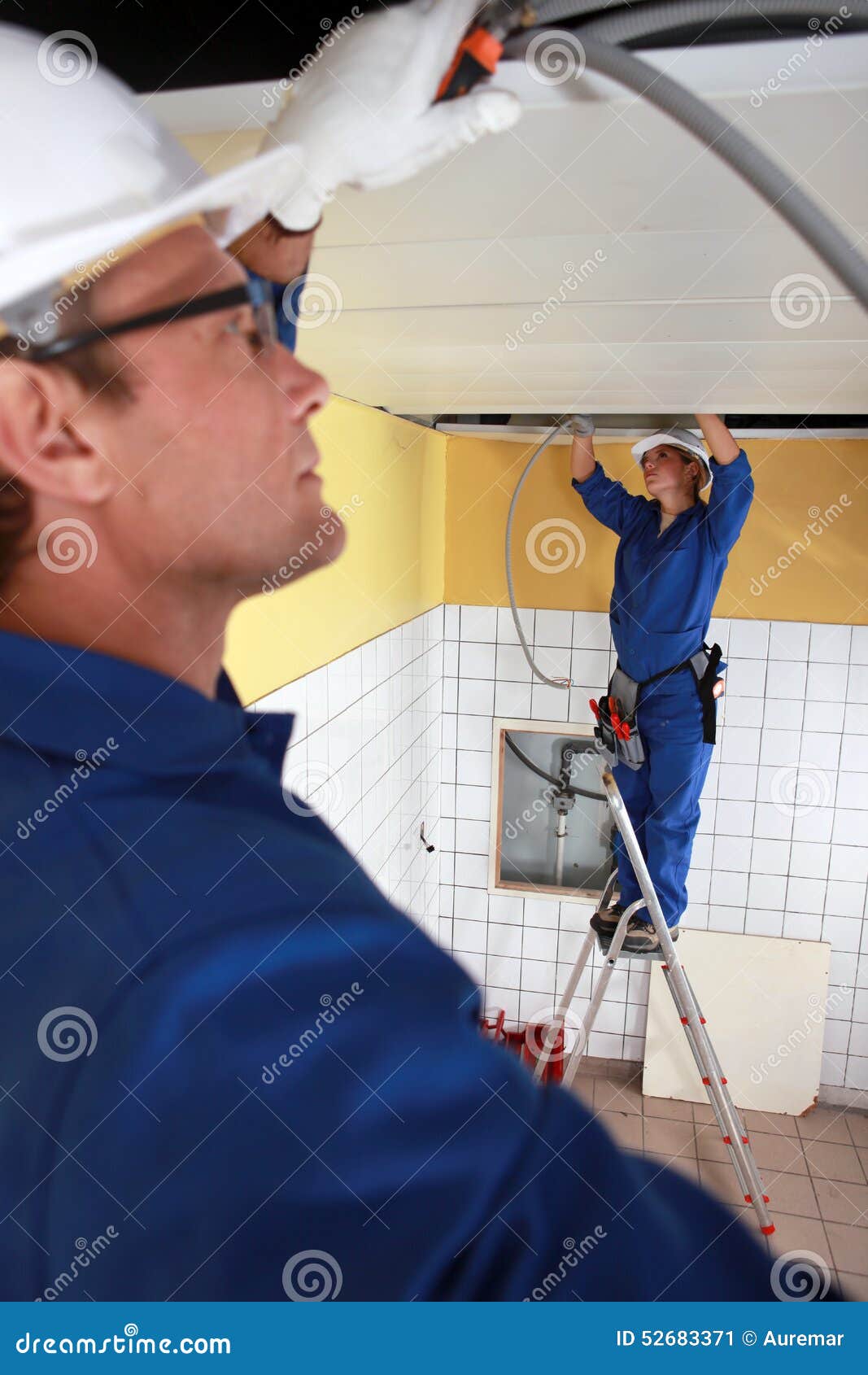 Laborers installing piping stock image. Image of piping - 52683371