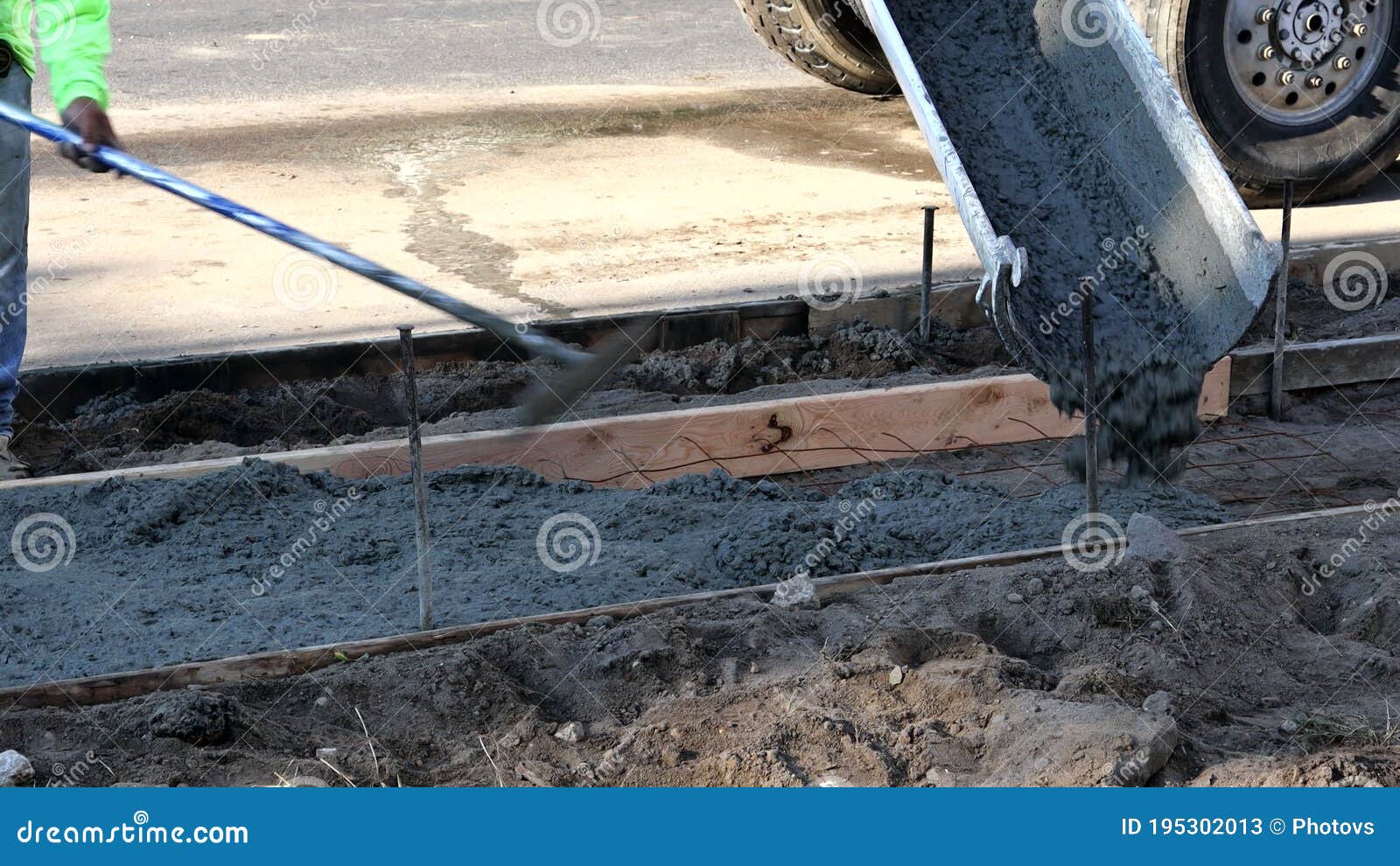 Labour Builders at Construction Site Filling Formwork with Cement ...
