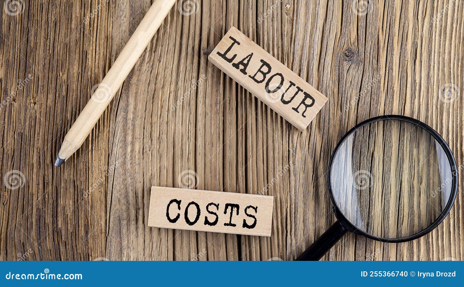 LABOUR COSTS Words on Wooden Building Blocks on the Wooden Background ...