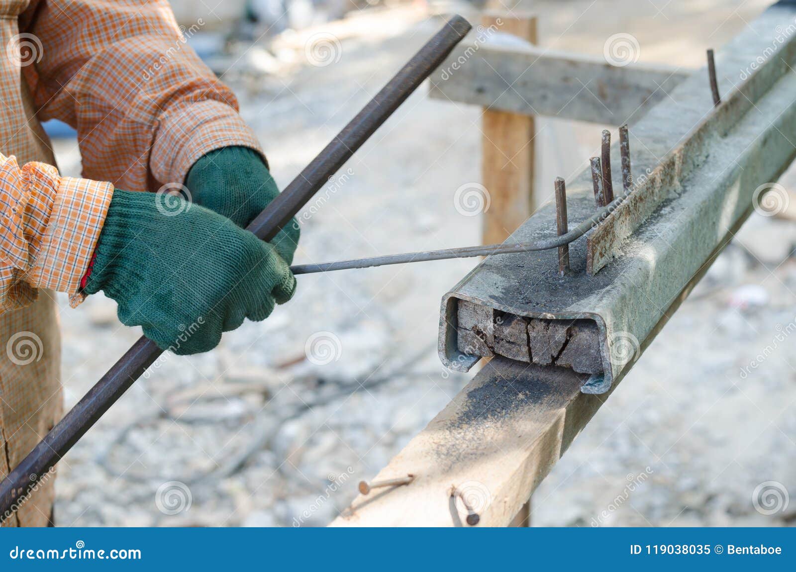 Bending Reinforcement Metal Rebar. Worker Using Bending Rebar Machine ...