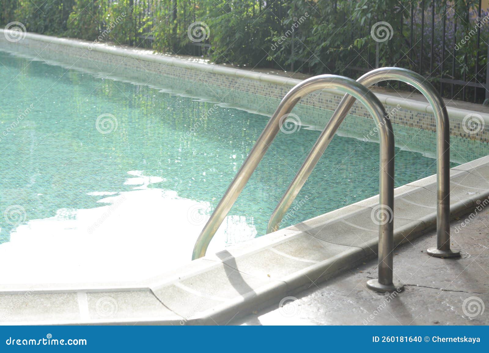 Ladder with Grab Bars in Outdoor Swimming Pool Stock Photo - Image of ...
