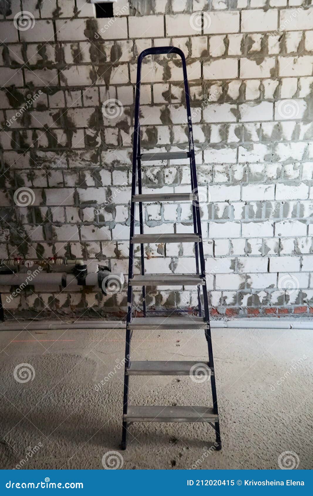 Ladder Near a Brick Wall Inside of a Room Being Refurbished or Built ...