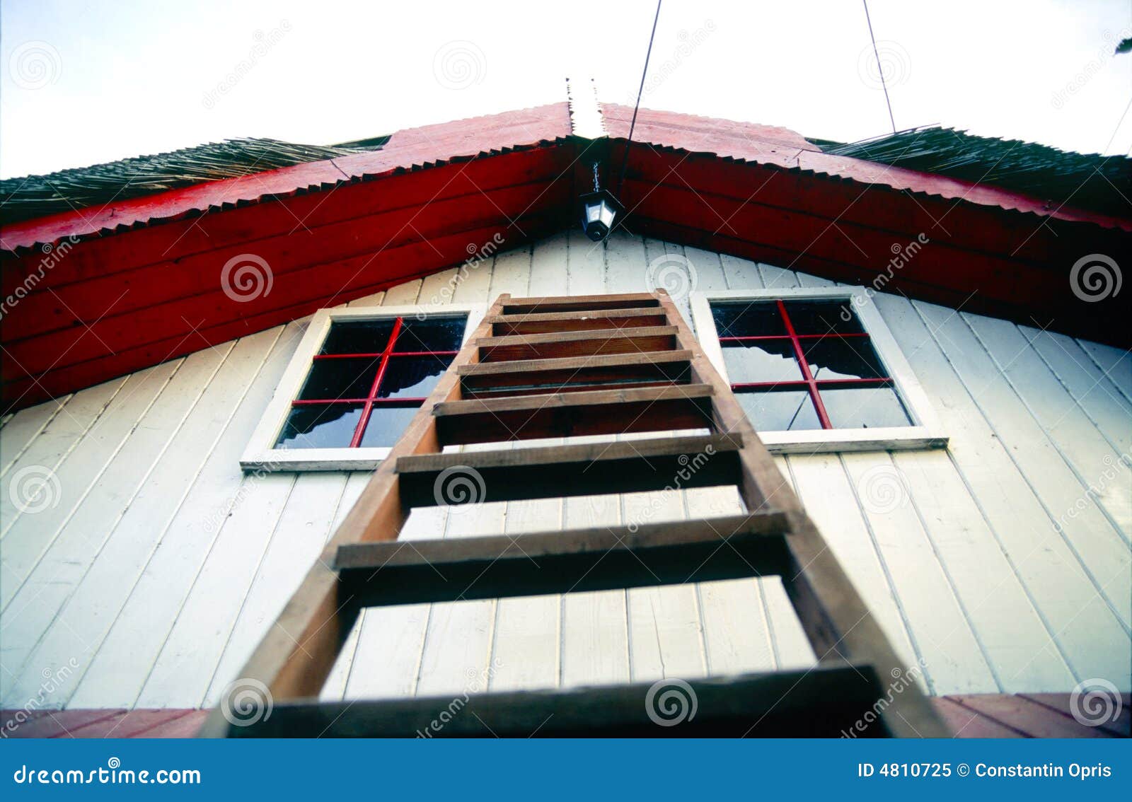 Ladder on side of house stock image. Image of roof, looking - 4810725