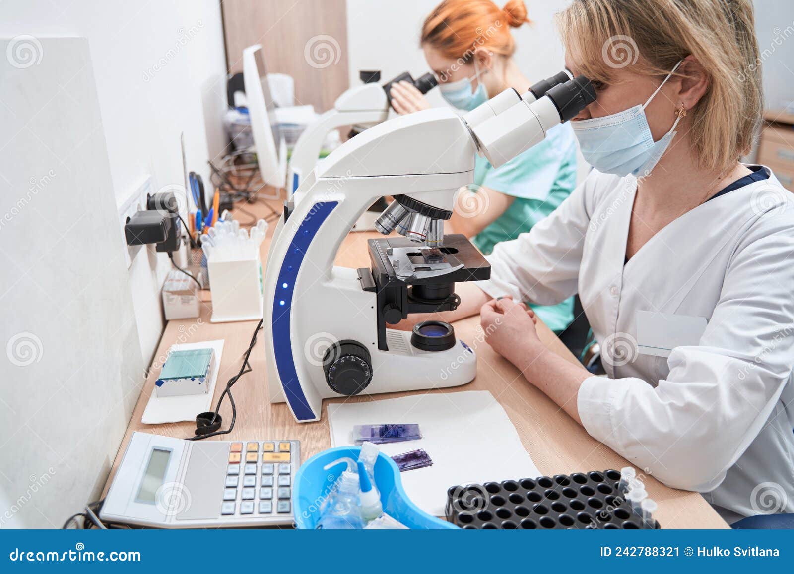 Medical Workers in the Laboratory with Microscopes Stock Image - Image ...
