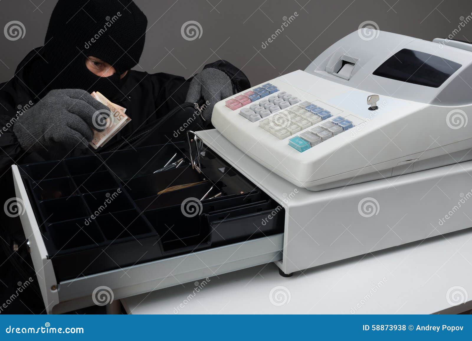 Ladrón Stealing Money foto de archivo. Imagen de primer - 58873938