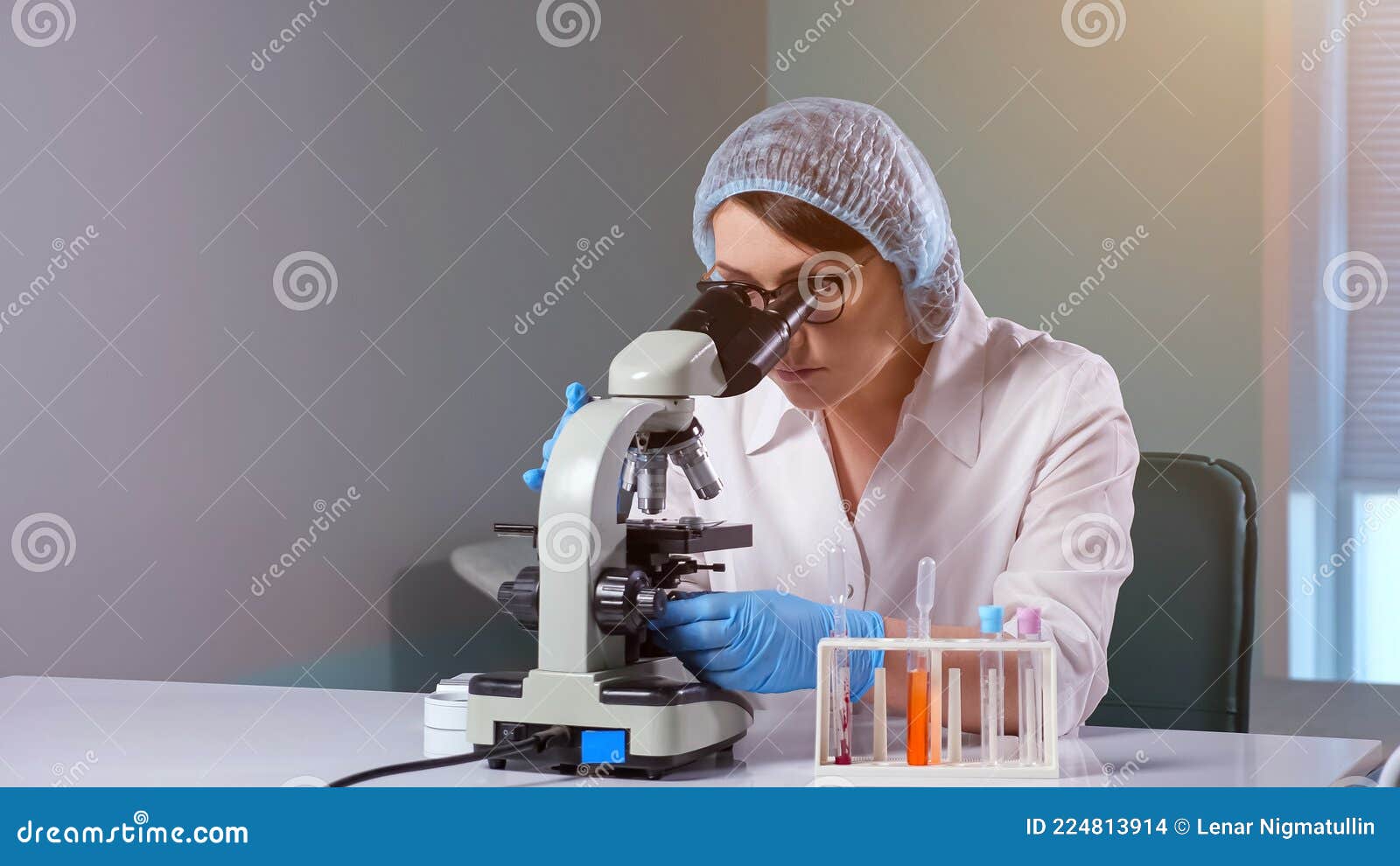 Lady Adjusts Microscope Working with Sample in Hospital Stock Photo ...
