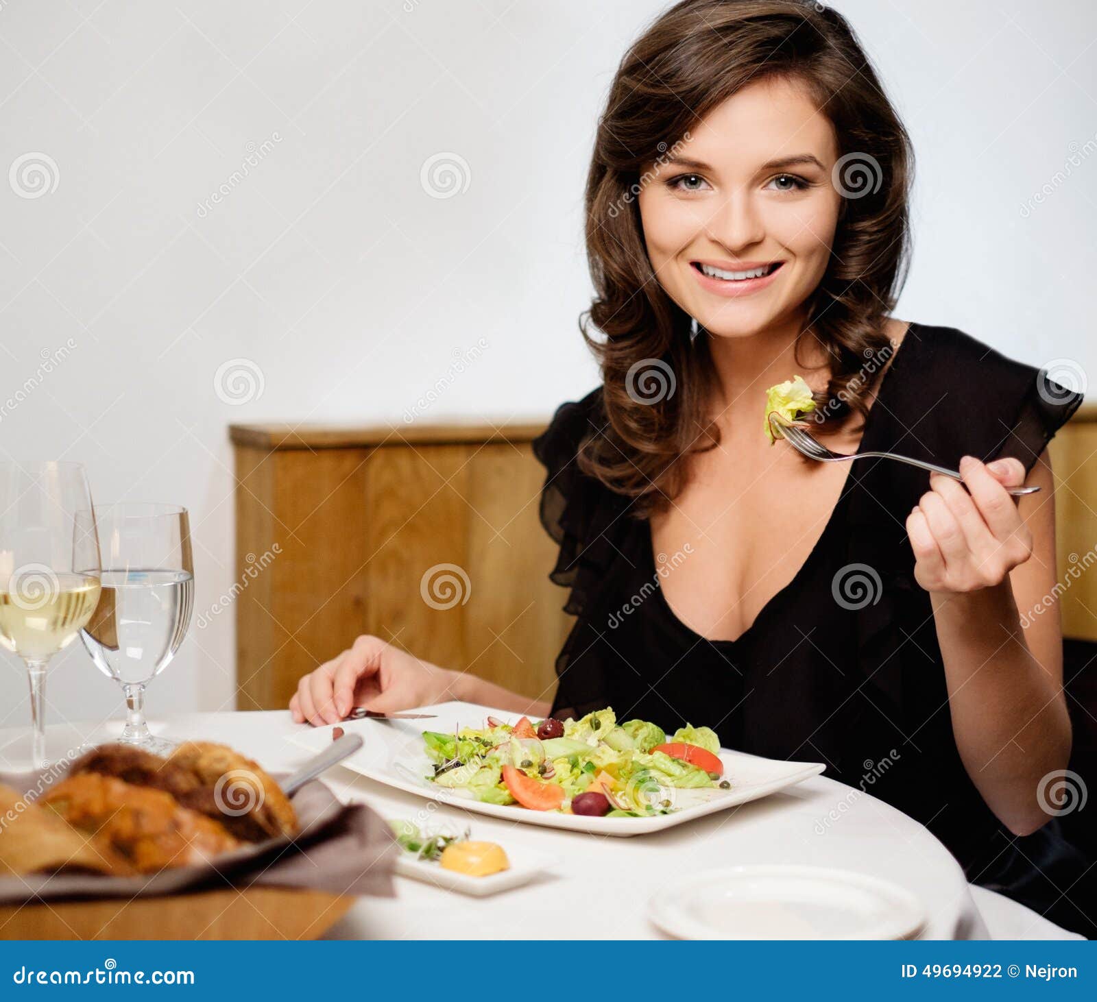 Lady alone in restaurant stock photo. Image of dish, elegant - 49694922