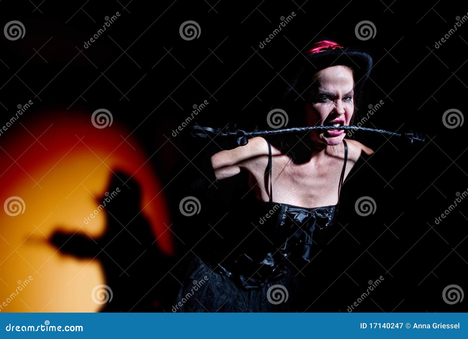 Lady in black carries whip stock image. Image of caucasian - 17140247