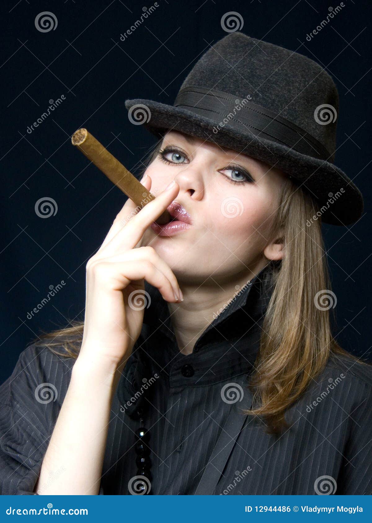 Lady in black and a cigar stock photo. Image of dangerous - 12944486