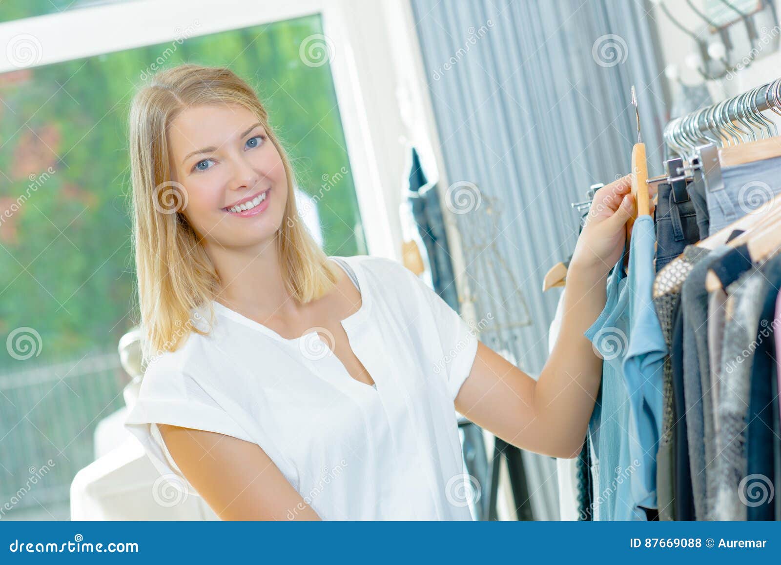 Lady Browsing in Clothes Shop Stock Photo - Image of browse, choosing ...