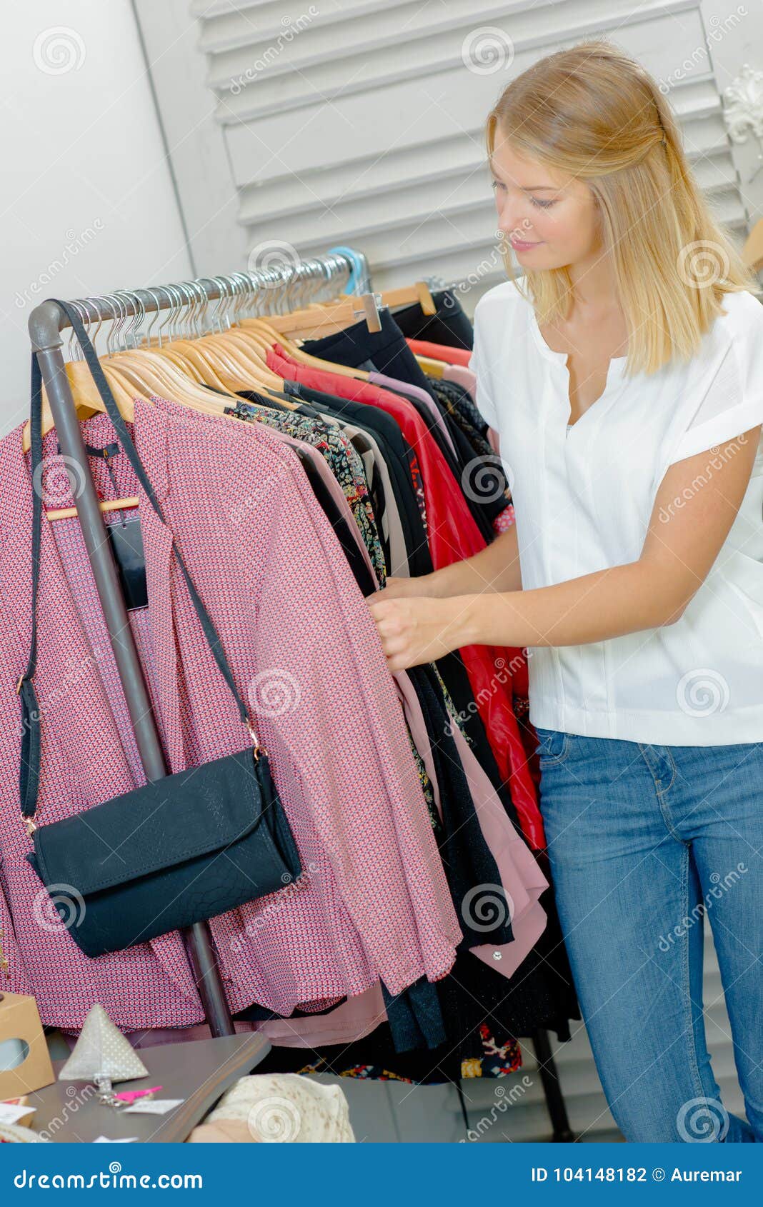 Lady Browsing through Rail Clothes Stock Photo - Image of louvre ...