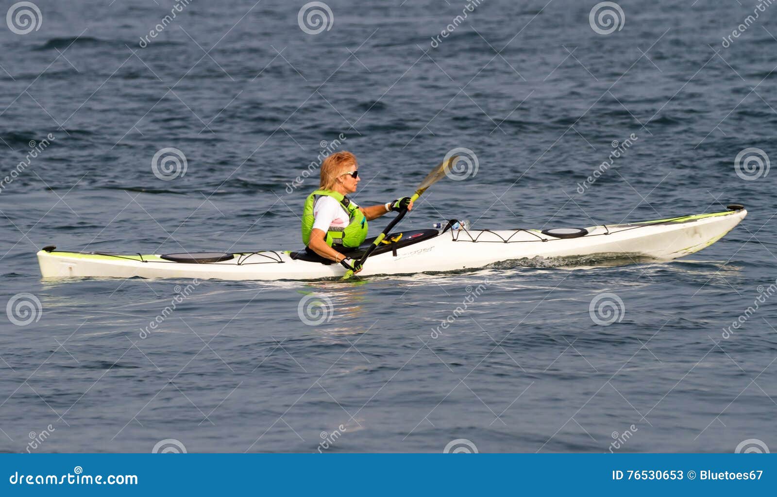 A lady canoeing editorial stock photo. Image of female - 76530653