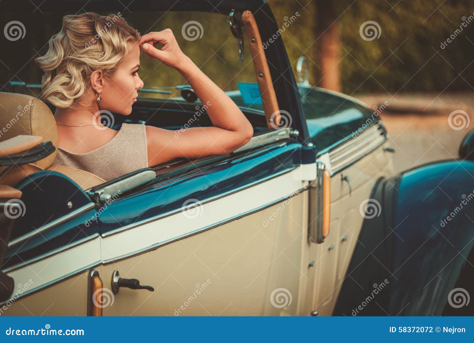 Lady in a classic car stock photo. Image of steering - 58372072