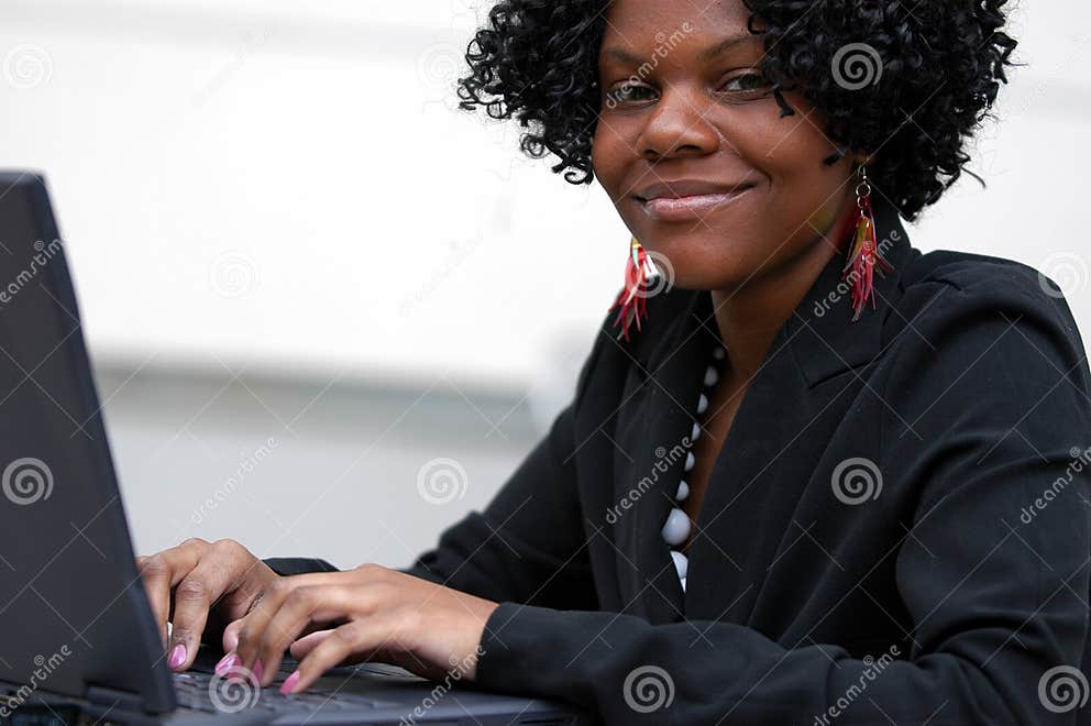Lady on computer smiles stock image. Image of workforce - 178707