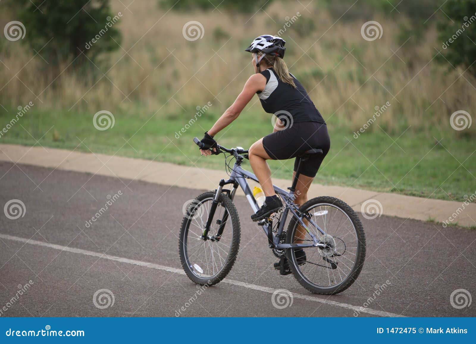 Lady Cycling stock image. Image of helmet, highway, calf - 1472475