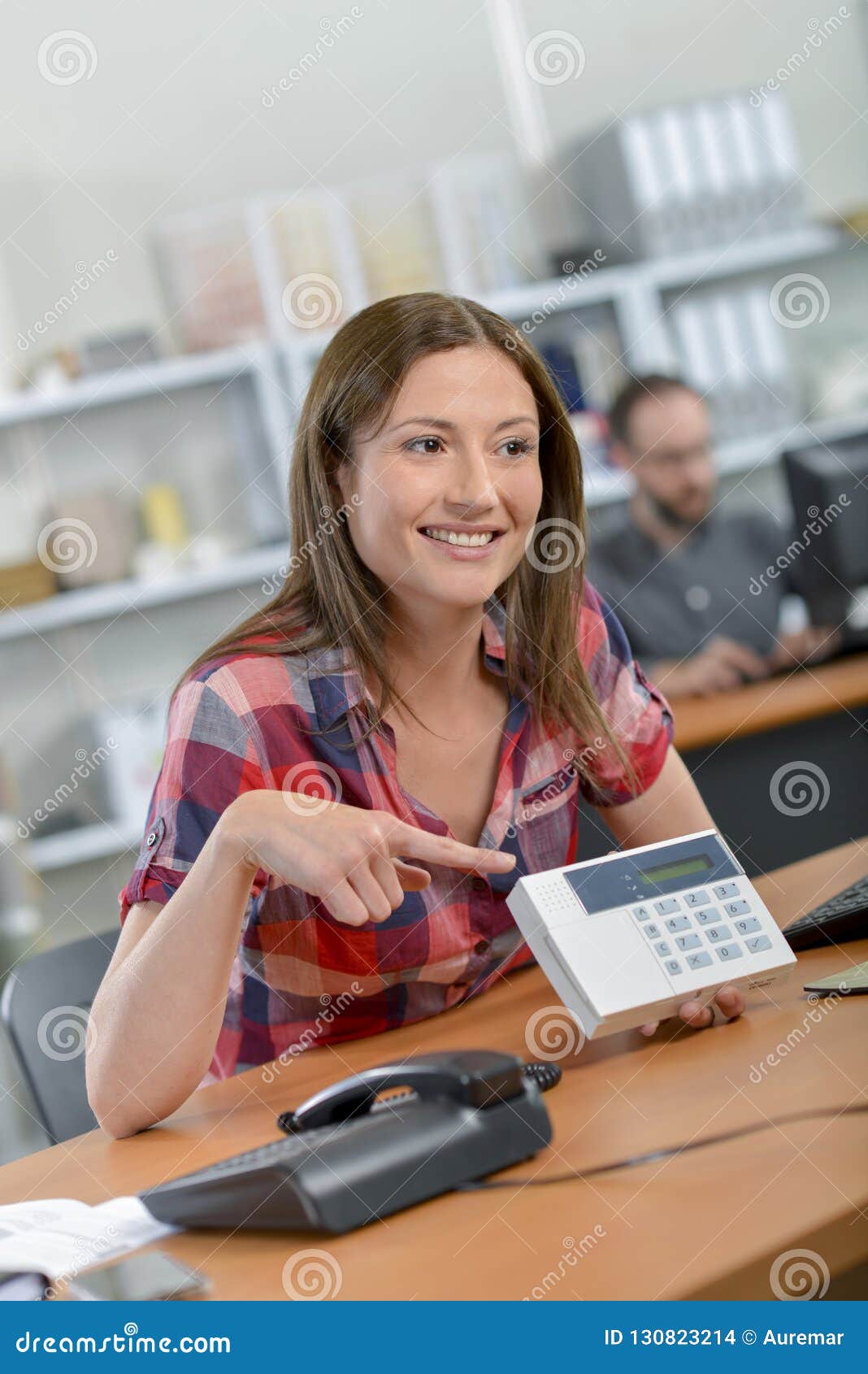 Lady at Desk Pointing To Display on Calculator Stock Photo - Image of ...