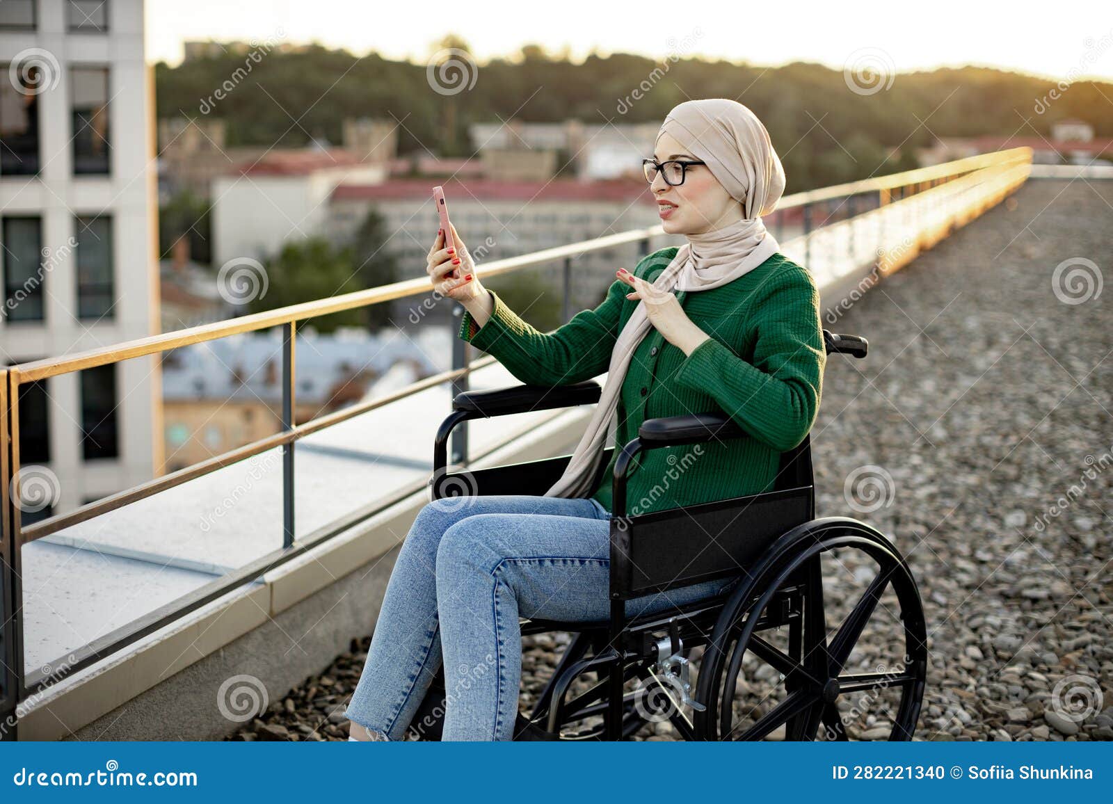 Lady with Disability Taking Selfie on Mobile on Flat Roof Stock Photo ...