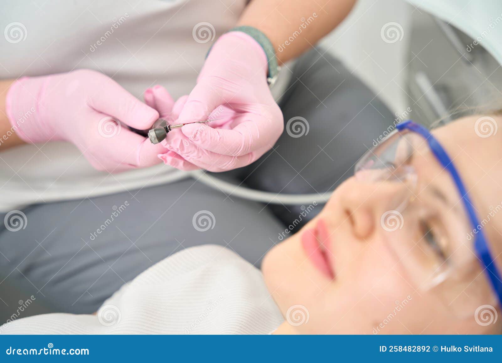 Lady Doctor Inserts a Drill into a Drill Stock Photo - Image of ...