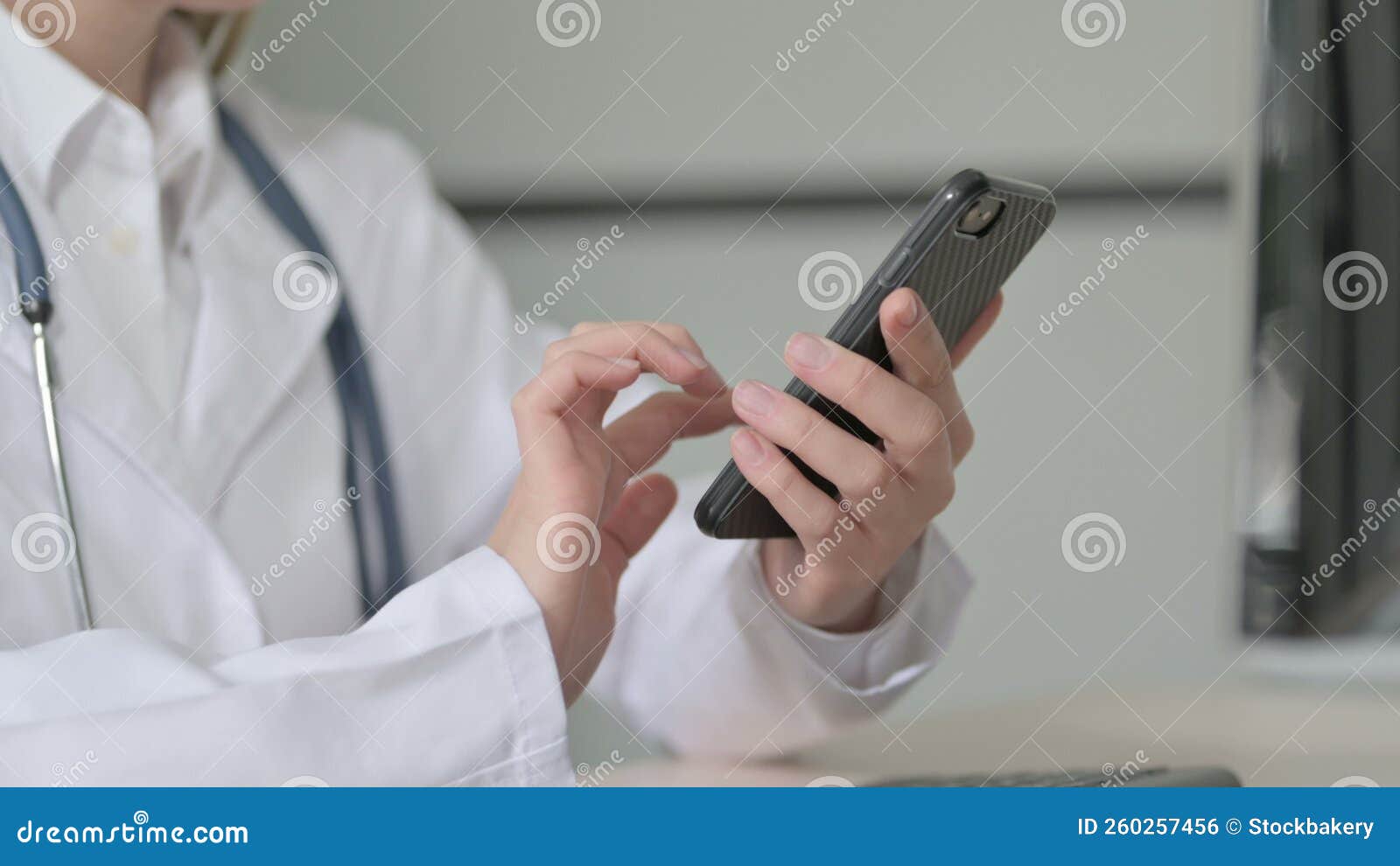 Close Up of Female Doctor Using Smartphone for Browsing Internet Stock ...