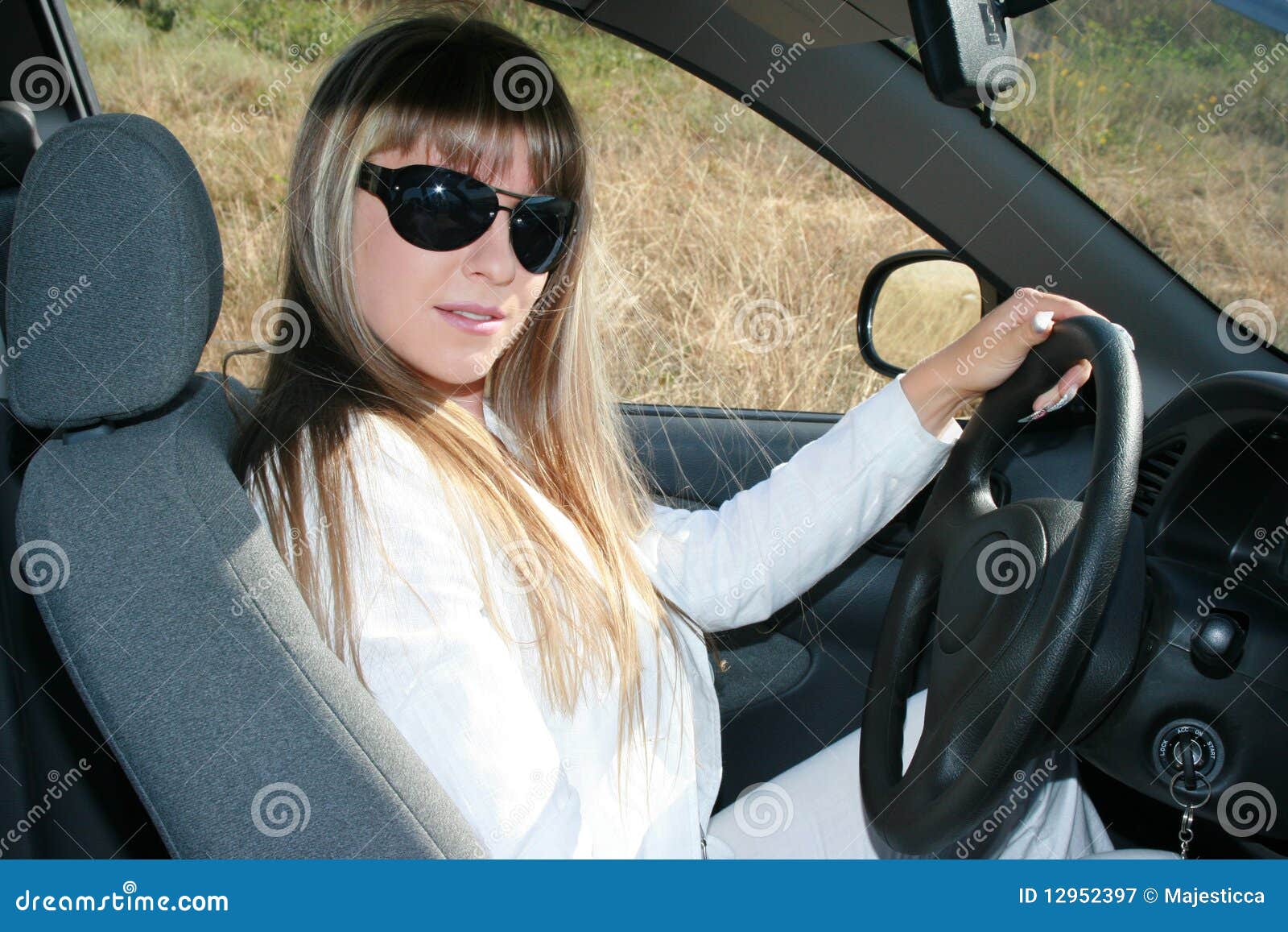 Lady-driver in the car stock image. Image of businesswoman - 12952397